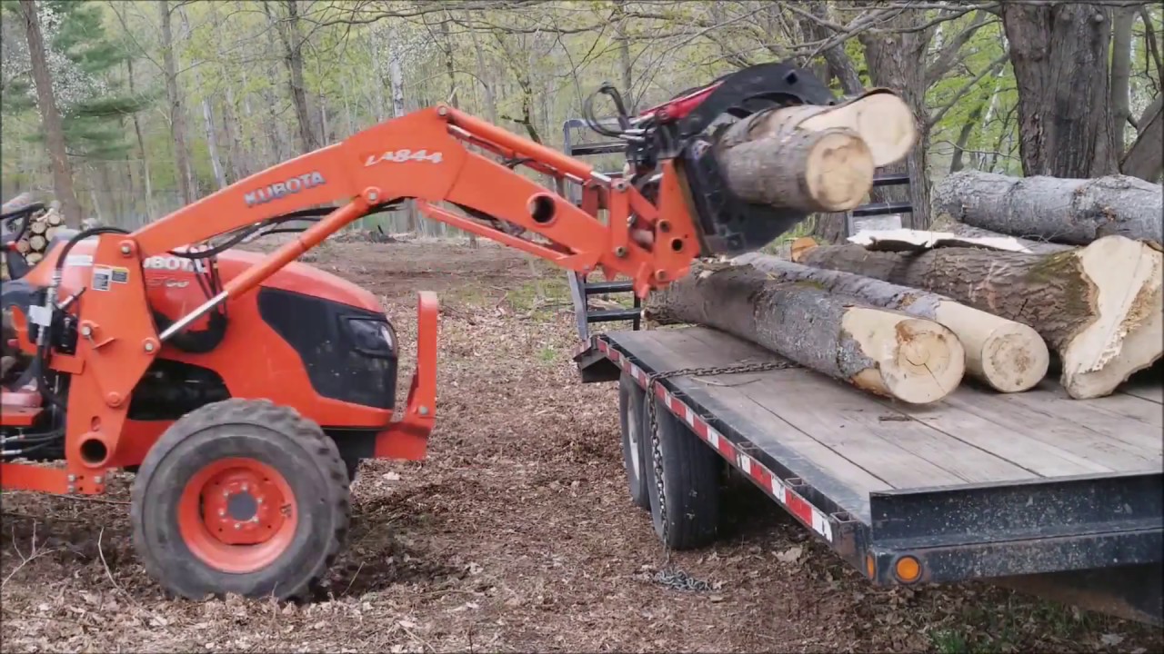 log loading with Kubota and grapple