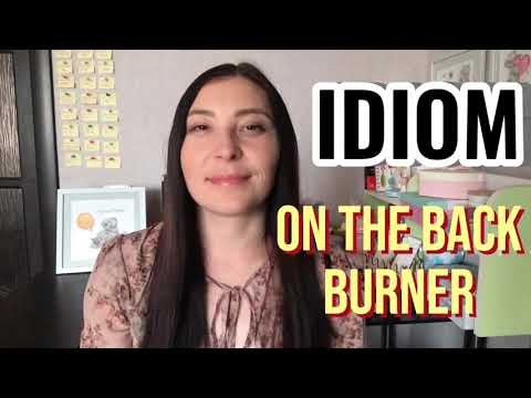 ON THE BACK BURNER. Idiom