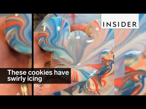 This chef's sugar cookies are topped with swirly icing