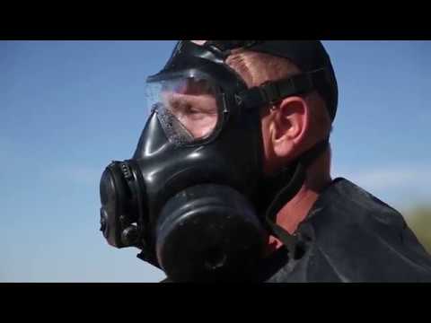 US Soldier doffing chemical gear