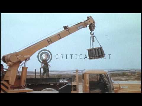 U.S. soldiers handling 155mm artilery shells in an ammunition dump at Long Binh, ...HD Stock Footage