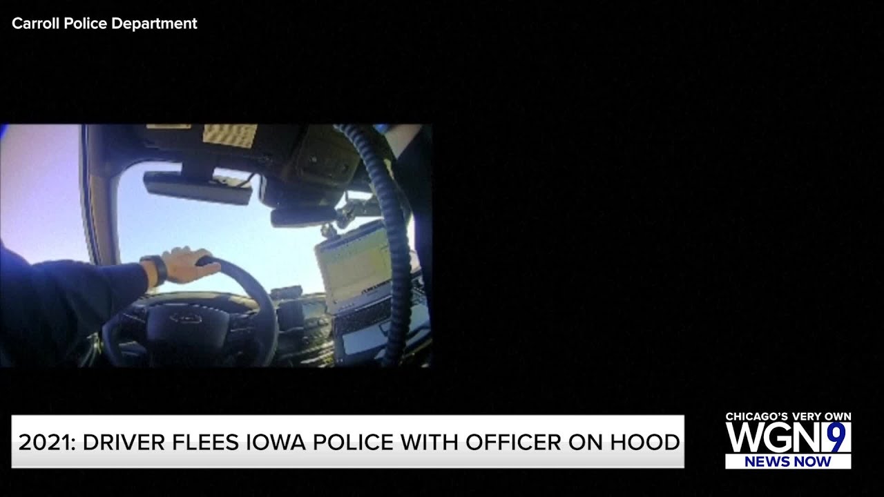 Video shows Chicago area driver fleeing Iowa police with officer on hood, roof of car