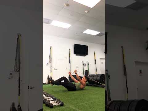 low band isometric crunch (hollow hold) + alternating knee tucks