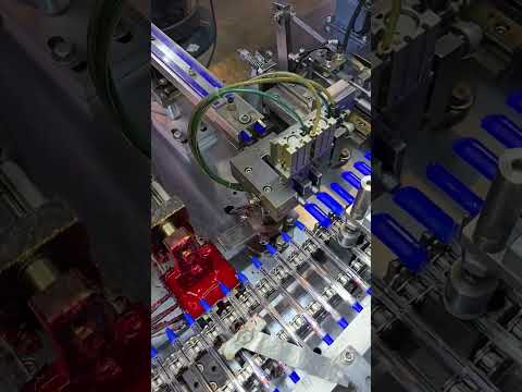 Automated production of ballpoint pen tip wax caps