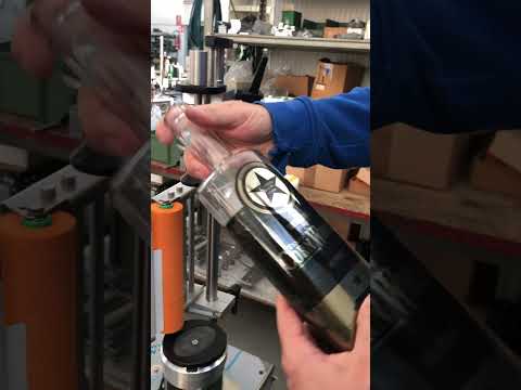 Semi-automatic labeller S1/MZ with shaped bottle and wraparound label