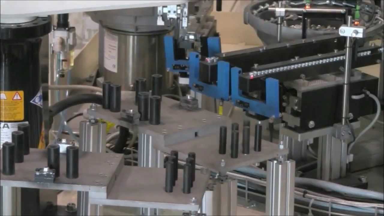 Injection cycle with insertion of 28 metal inserts - ESI Robotics ...