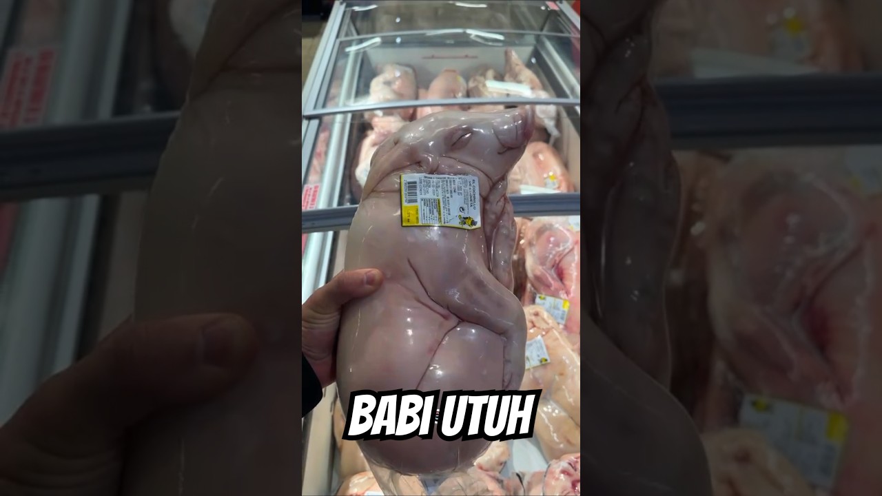 Piglets for sale in a Russian mall. They look strange because they are still intact.