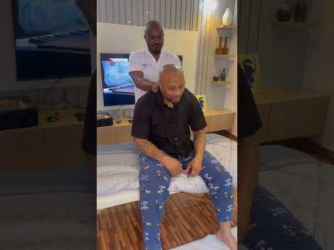 Dr. Paul on a chiropractic session with B-red