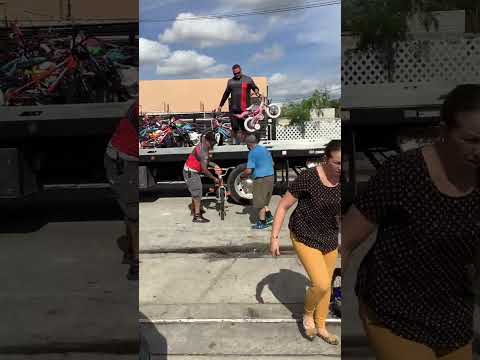 Unloading bicycles for Christmas Giveaway at Guatemalan Maya Center