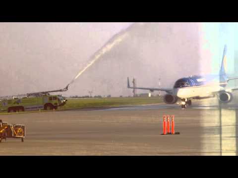 Frontier Midwest Airlines Flight 1648 Return to Bloomington IL airport from Denver Fire Truck Salute