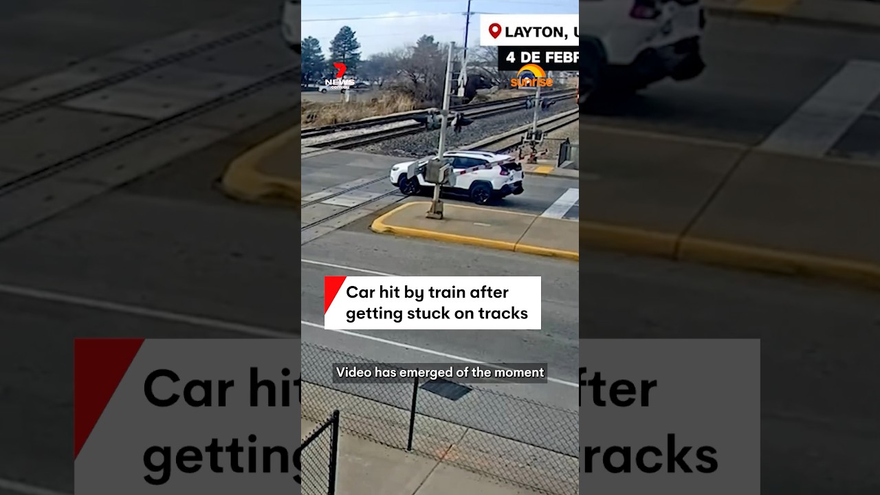 Car hit by train after getting stuck on tracks
