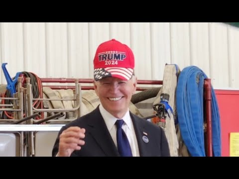 Joe Biden photographed wearing a Trump campaign hat