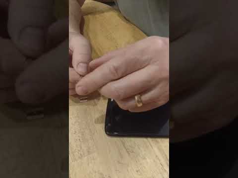 Stuck or broken SIM card tray.