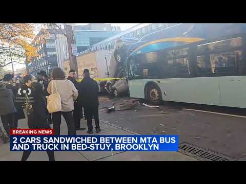 2 cars sandwiched between MTA bus and truck in Bed-Stuy, Brooklyn