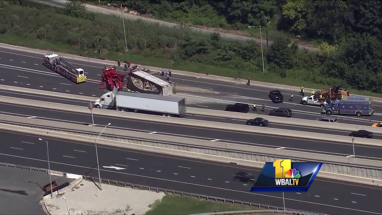 Video: Tractor-trailer overturns on I-895