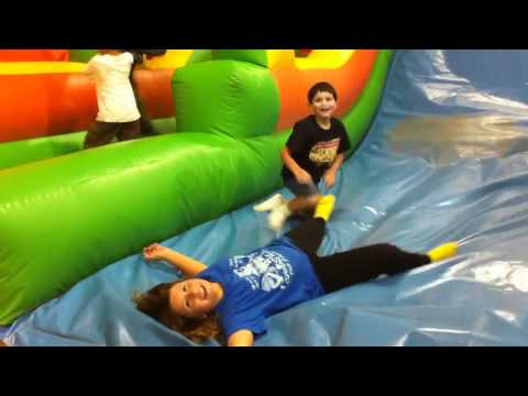 Hannah & Seth on the big slide at Scooter's Jungle