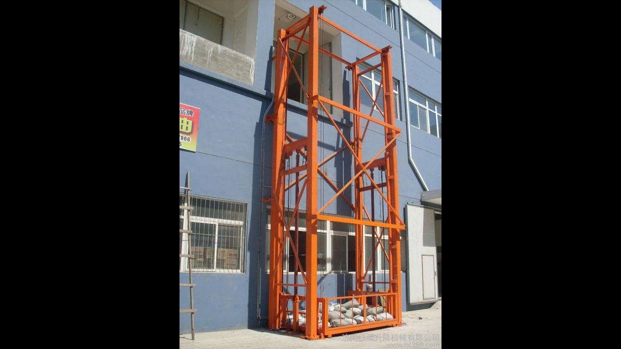 Rail guide cargo lift platform