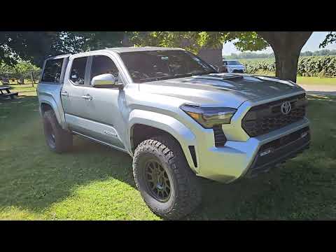2024 Toyota Tacoma Sport, Westcott lift, 35 inch tires, Method 703 wheels, and a Smartcap topper.