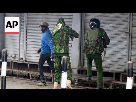 AP photographer recounts capturing a Kenya police officer shooting a man
