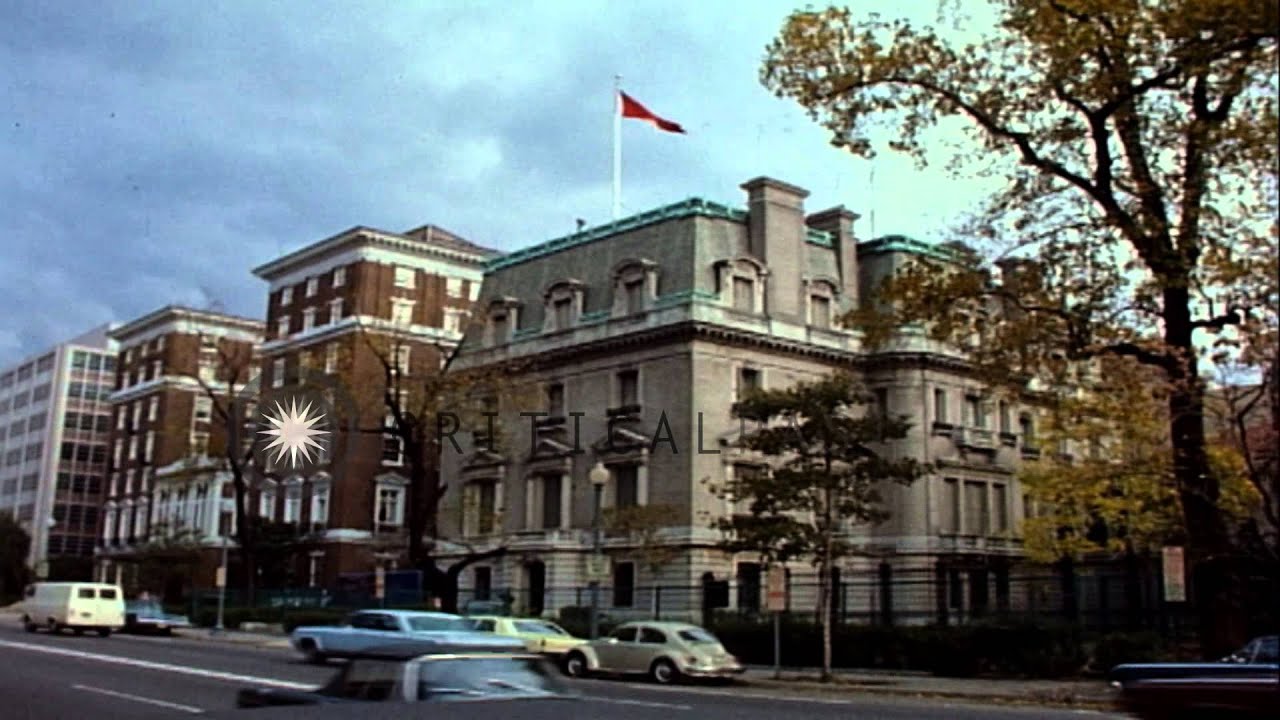 Soviet Flag flutters in wind from flagpole on top of Old Soviet Embassy building ...HD Stock Footage