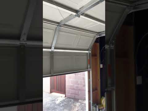 Overhead New Garage Door Installation in Woodland Hills, CA by Pros Garage Door Inc. 888-906-6292