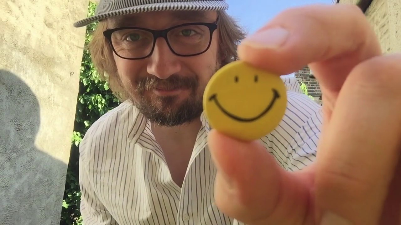 The smiley face icon with Ed Gill