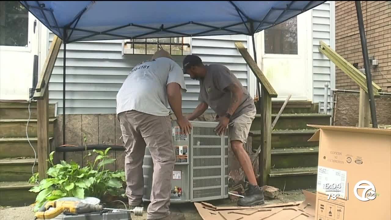 HVAC technicians race to repair air conditioning units as the heat moves in