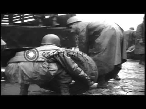 United States soldiers assemble a 75 mm howitzer and are issued pack boards in It...HD Stock Footage