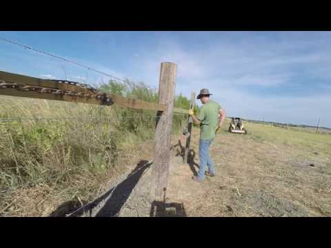 Running & stretching barbed wire fence
