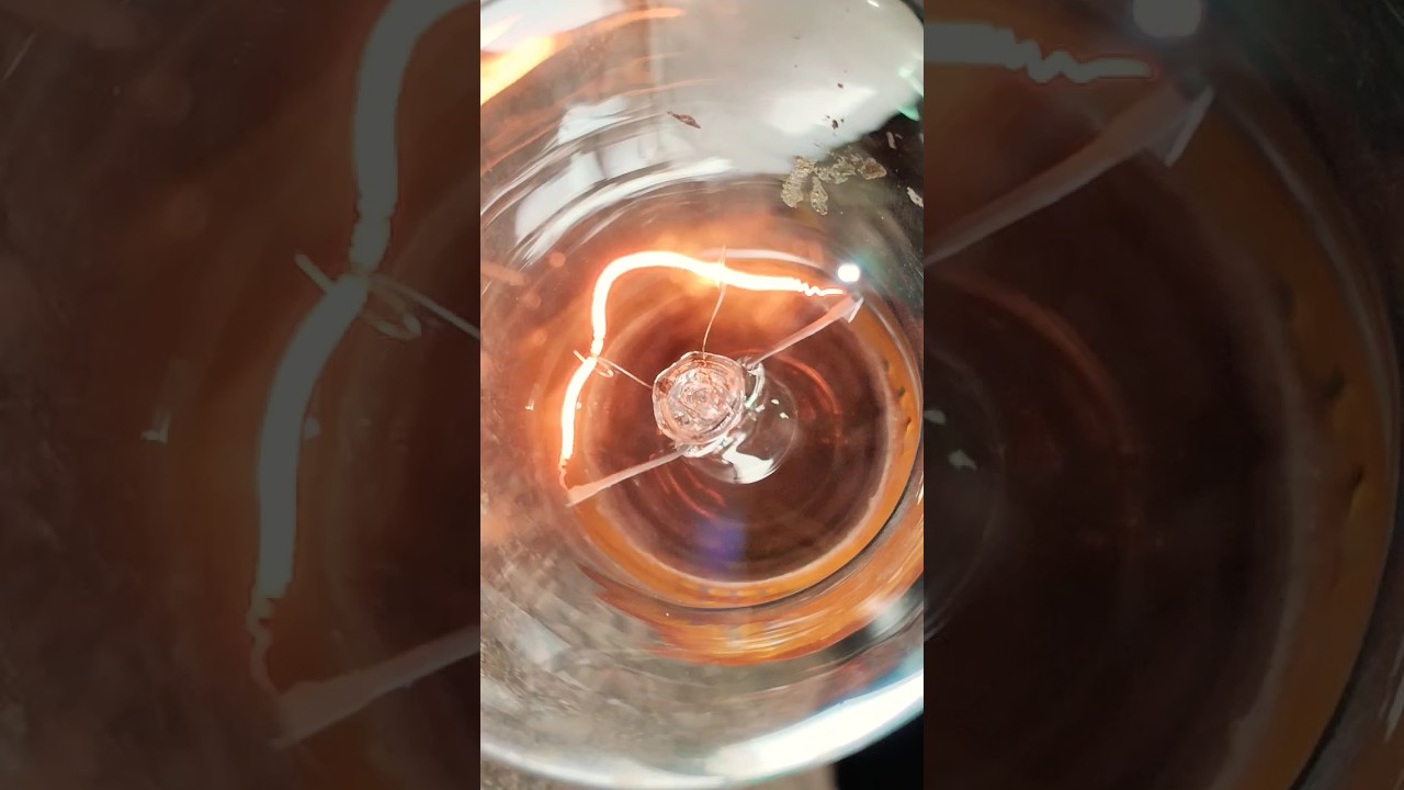 Tungsten wire burning inside the bulb. #sorts #experiment #scienceexperiment