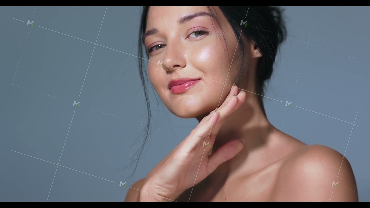 Elegant Woman With Natural Makeup And Glowing Skin Posing In Studio