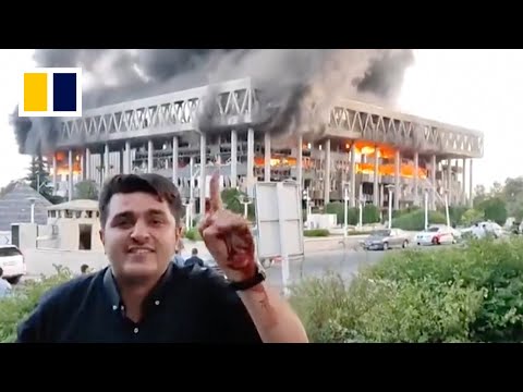 Watch moment Iran state TV live broadcast interrupted by Israeli air strike