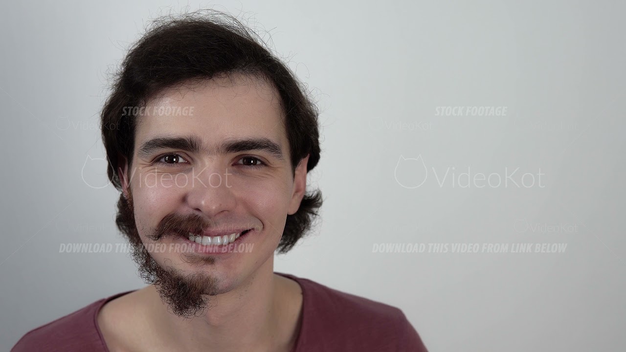 Portrait of happy man who has not finished shaving his face on a white background