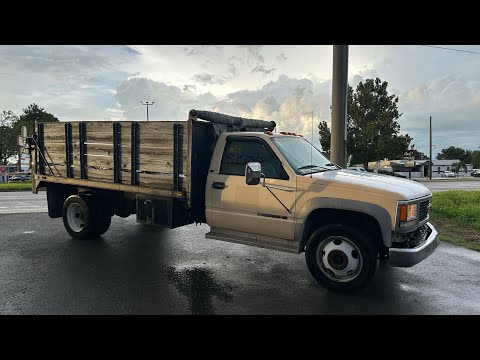 SOLD 1997 GMC 3500HD flatbed/stakeside lift gate 6.5 Diesel 60k original miles