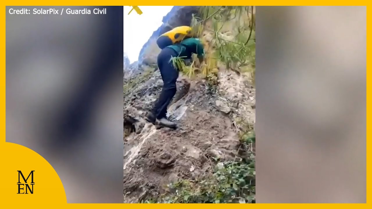 Moment helicopter swoops in to recover body of a man believed to be ...