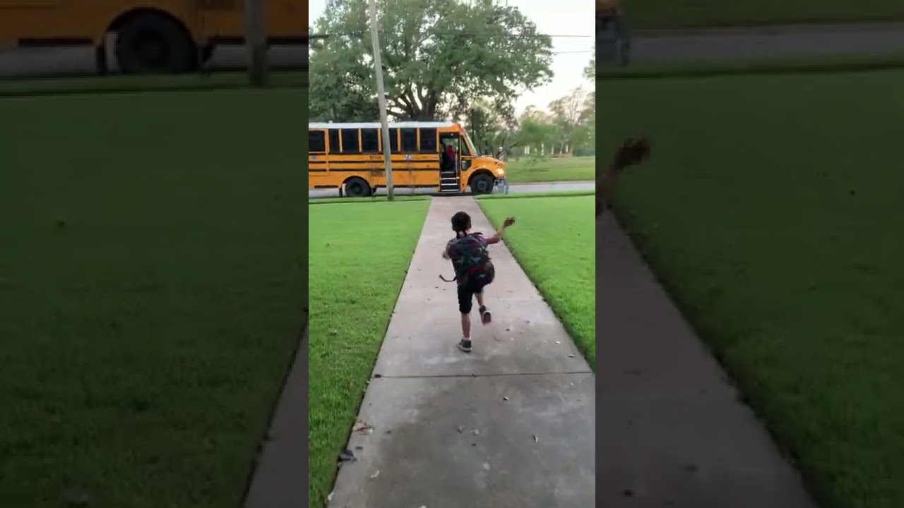 Little Boy Falls Onto Grass While Running to Catch School Bus - 1361653