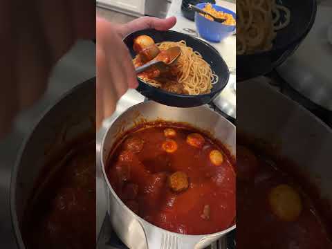 Homemade Spaghetti With Meatballs,Italian Sausage,Pork And Boiled Eggs.