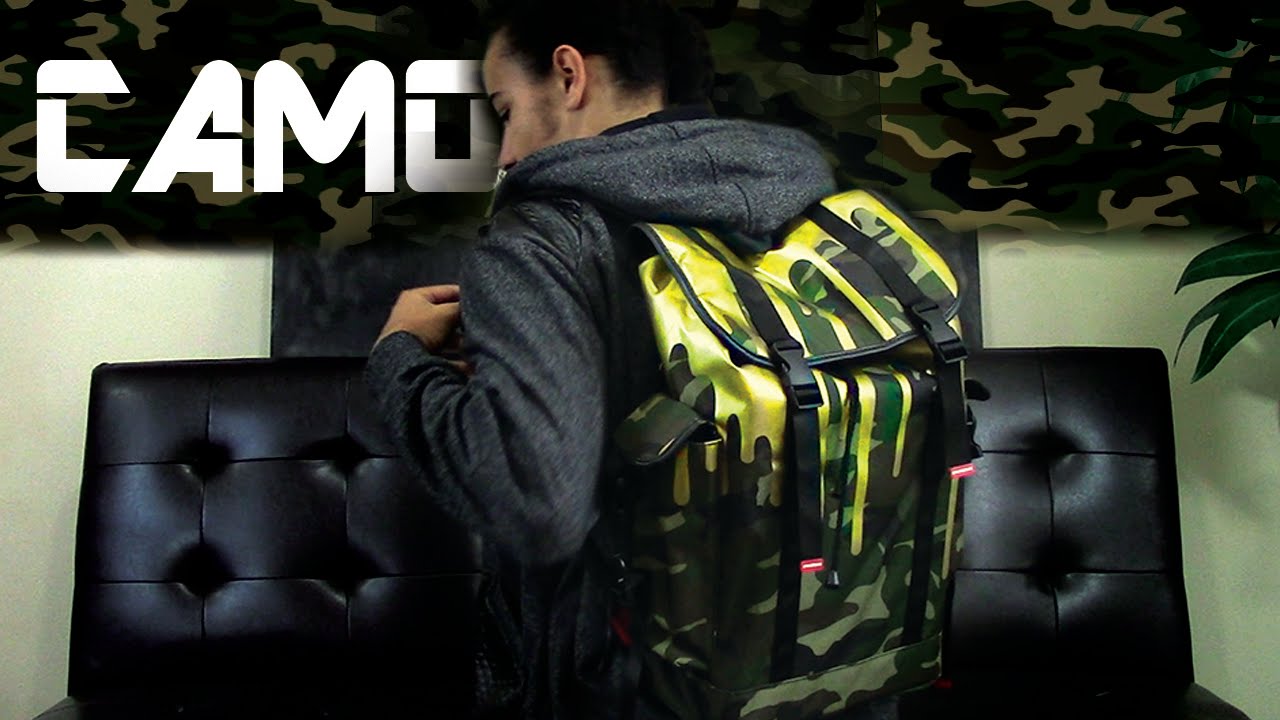 Unbxng - Sprayground Gold Dripping Camo Recon backpack