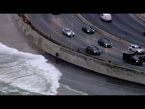 Cyclist Lake Michigan Wave - Biker Gets Knocked Over by Wave