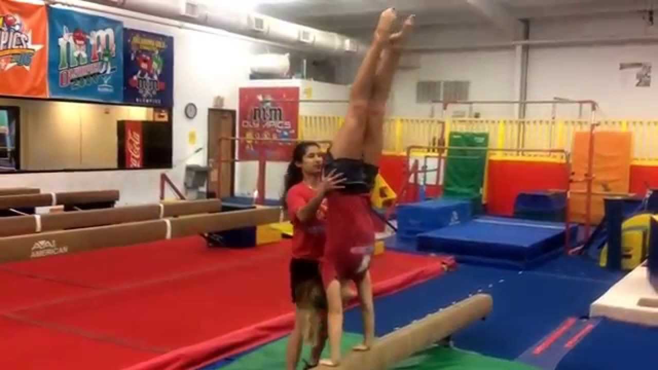 Handstand dismount on beam