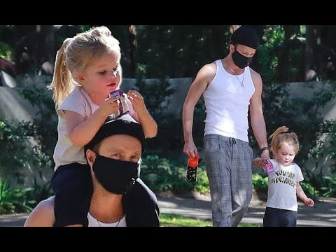 Aaron Paul is a doting dad as he carries daughter on shoulders in LA
