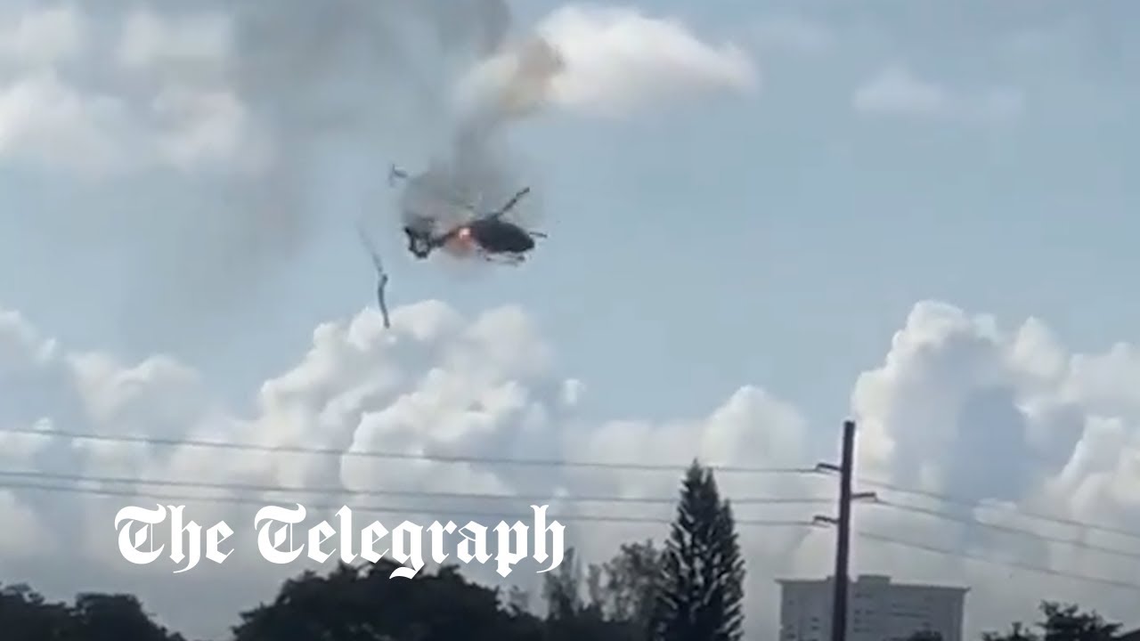 Helicopter on fire crashes into building in Florida
