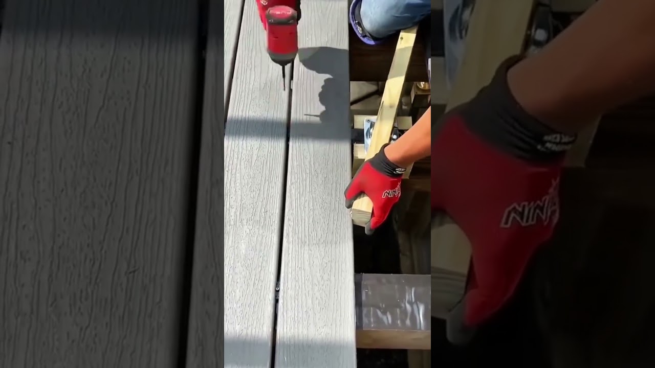 Installing composite decking boards using a power drill for precise alignment