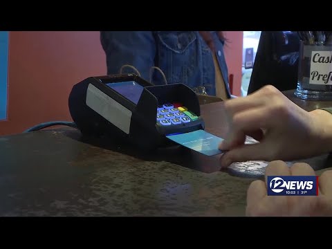 Credit card processing fees: Who should pay them?