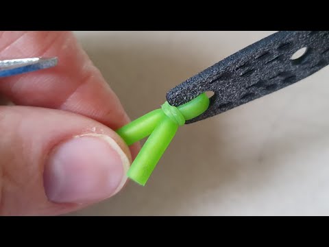 Quick method for attaching slingshot pouches to tube bands with needle