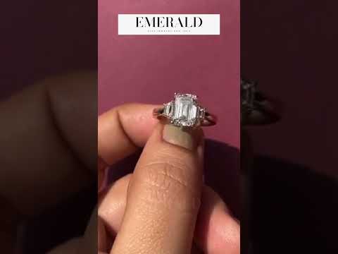 "Stunning Emerald Cut Three Stone Engagement Ring โ A Timeless Symbol of Love & Elegance"
