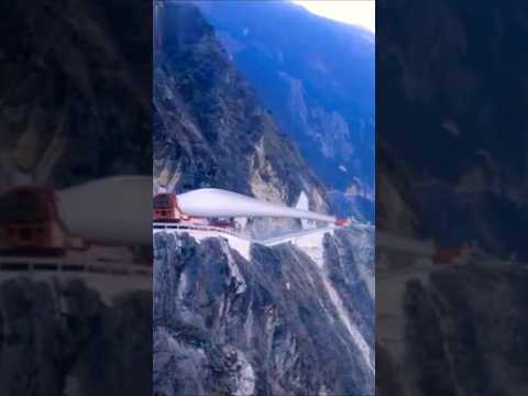 Huge wind turbine blade being transported over the edge.Sichuan