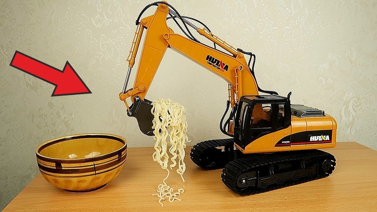 EXCAVADORA A CONTROL REMOTO DE CHINA HUINA 1550 RECOGE FIDEOS