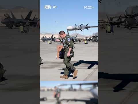 US Air Force F-16 Fighter Jet Pilot Checks Weapons