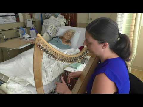South Shore Hospital volunteer plays harp to help heal patients